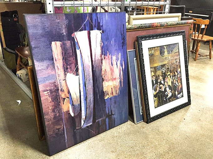 Wall art waiting for its second act. That abstract canvas might be from an undiscovered master or just someone's paint night creation&mdash;the mystery is part of the charm.