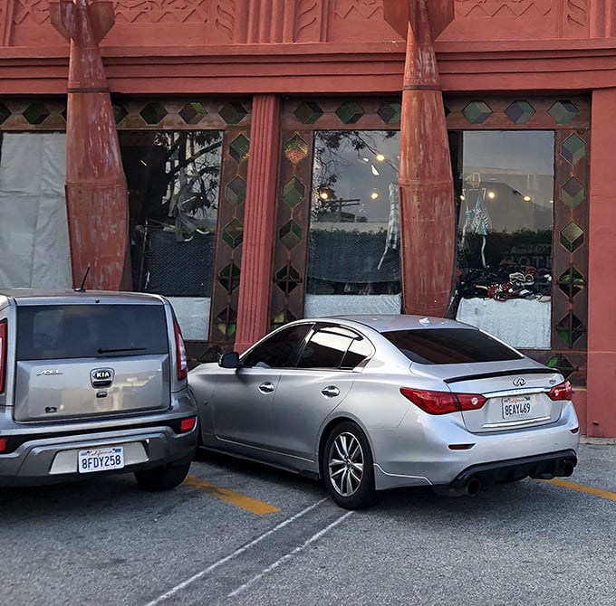 The parking lot where Sunday magic happens, transforming ordinary asphalt into a pound-sale paradise.