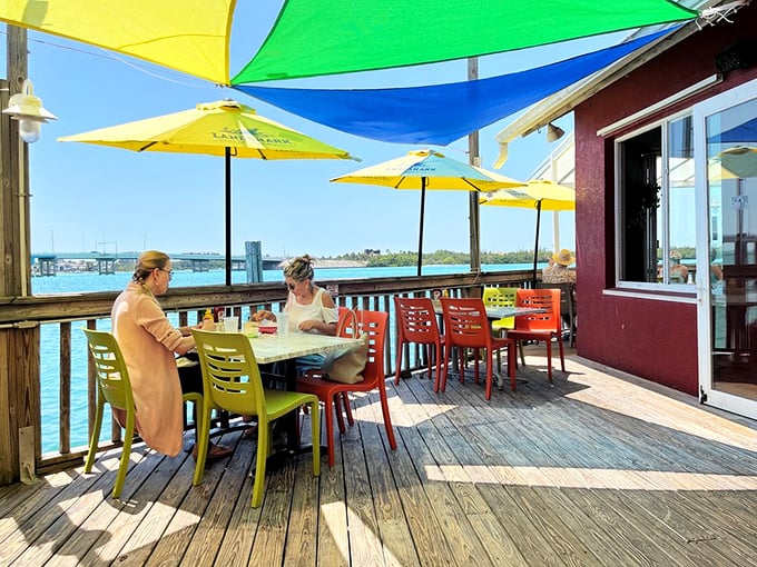 The patio where time slows down and conversations flow as freely as the drinks. Those colorful chairs and umbrellas aren't just furniture&mdash;they're vacation enablers.