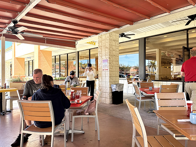 The outdoor seating area offers Florida's greatest luxury: enjoying your breakfast in sunshine mild enough that your ice water doesn't immediately become tea.