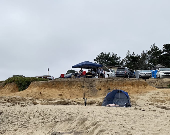 Weekend warriors stake their claim with tents and canopies, proving that beachfront real estate doesn't require a mortgage.