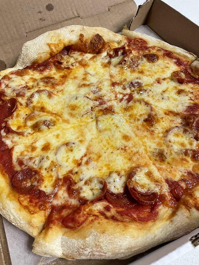 Pizza perfection doesn't need fancy toppings or artisanal anything&mdash;just the holy trinity of dough, sauce, and cheese that makes you believe in something greater.