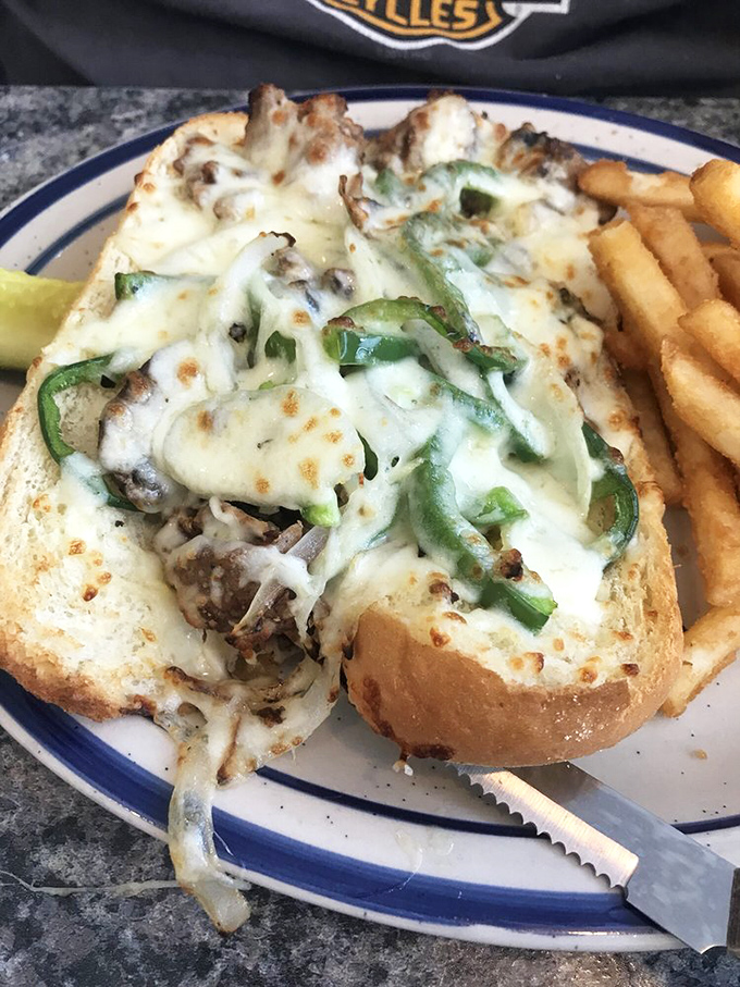 This Philly sandwich isn't messing around. Melted cheese cascading over seasoned meat and peppers&mdash;a handheld masterpiece requiring multiple napkins.