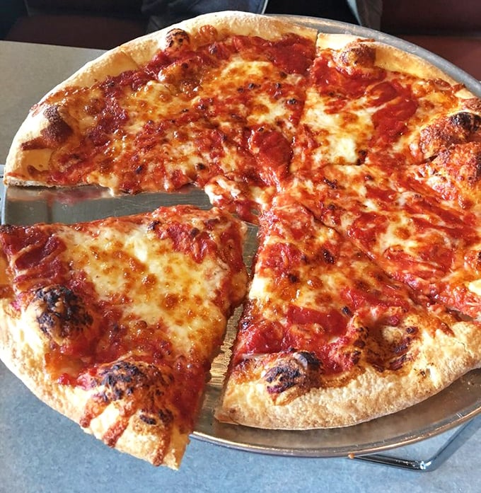 The signature swirl of sauce atop cheese&mdash;Grotto's trademark reverse engineering of pizza construction that somehow makes perfect sense.