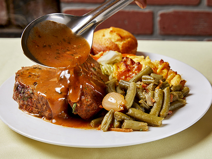 Gravy cascading over meat like a savory waterfall&mdash;this is the kind of food moment that deserves its own soundtrack.