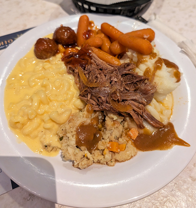A plate that grandma would approve of&mdash;tender pot roast, creamy mac and cheese, and stuffing that could start family feuds.