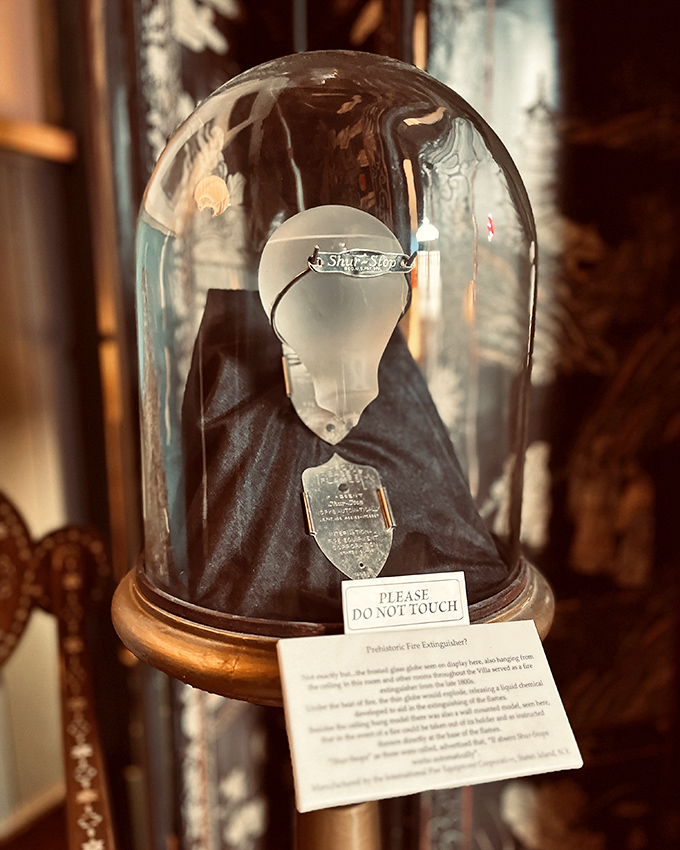 Not your average paperweight! This mysterious artifact under glass looks like it belongs in Indiana Jones' "things I probably shouldn't touch" collection.