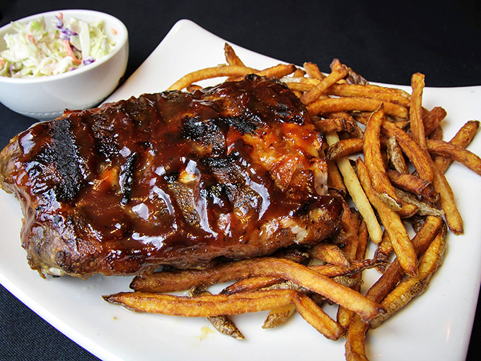 Glistening with sauce and falling off the bone, these ribs don't care about your shirt&mdash;they're too busy delivering smoky, sticky satisfaction with every bite.