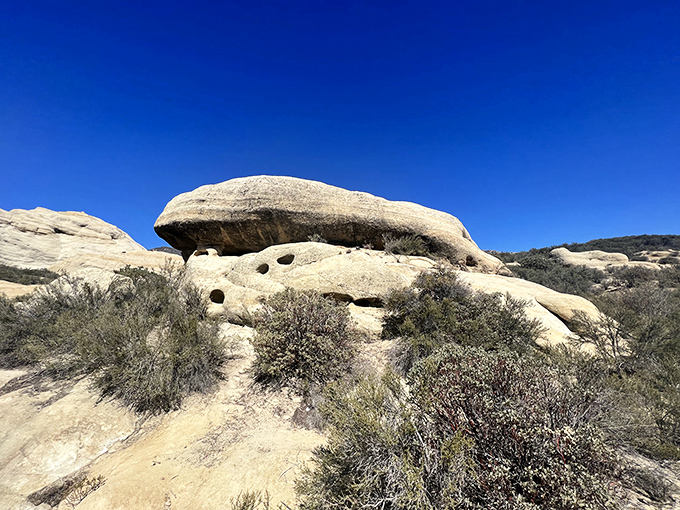 Nature's balancing act: this precariously perched boulder has withstood centuries of wind, rain, and earthquakes, yet still looks like it might roll away tomorrow.