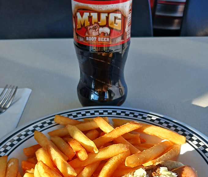 Nothing complements a hearty meal like an ice-cold Mug Root Beer – the unofficial beverage of nostalgic American dining experiences.