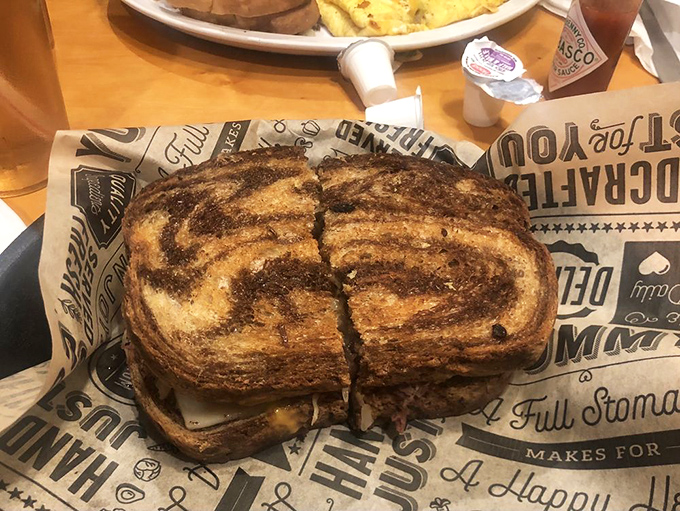 This towering Reuben sandwich showcases the kitchen's ability to craft satisfying meals beyond their breakfast specialties.