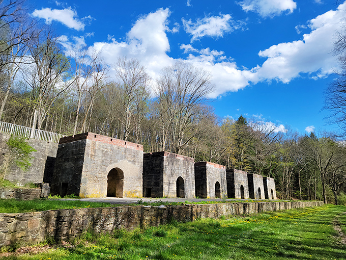 The historic iron furnace ruins stand as a stoic reminder that before selfies and scenic overlooks, this land powered American industry.