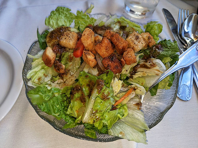 Fresh greens topped with golden croutons create the perfect prelude to your main seafood event of the evening.
