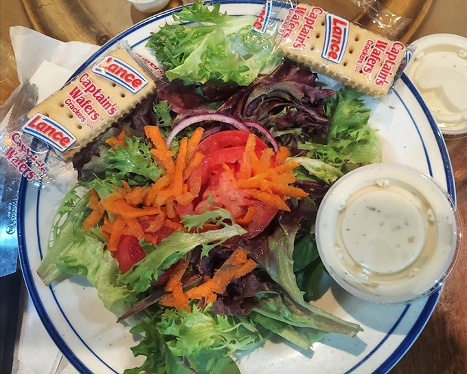 Even the salad gets the star treatment here, proving vegetables can share the spotlight gracefully.