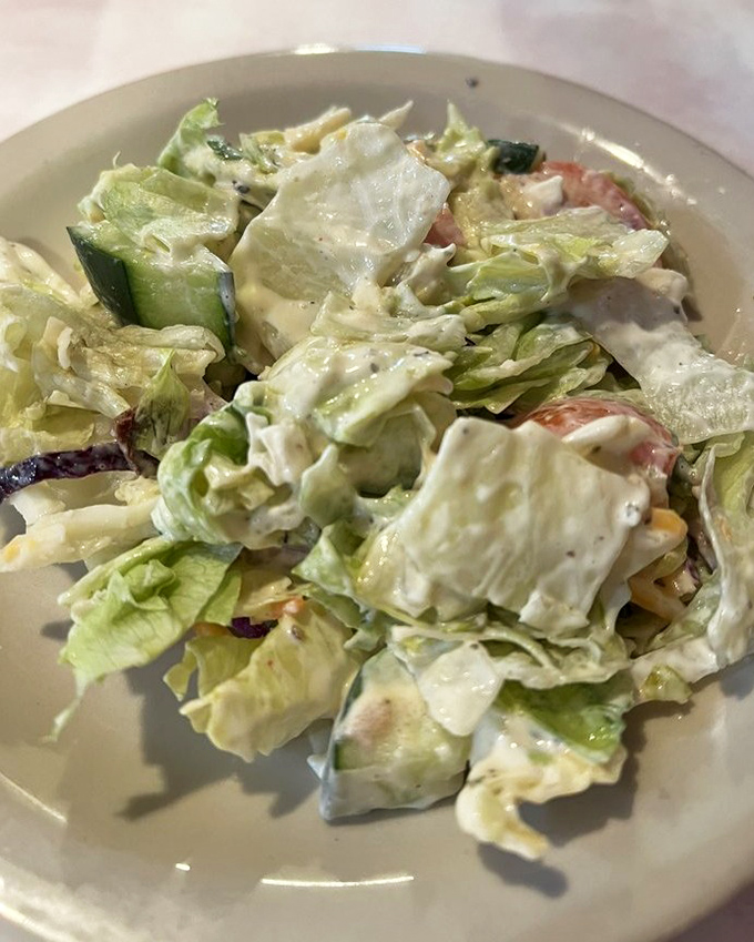 A house salad that didn't get the memo about being a boring obligation&mdash;creamy dressing, fresh vegetables, and enough flavor to hold its own.