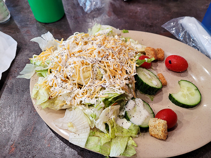 Even the salads here mean business, though ordering just greens feels like bringing a knife to a steak fight.