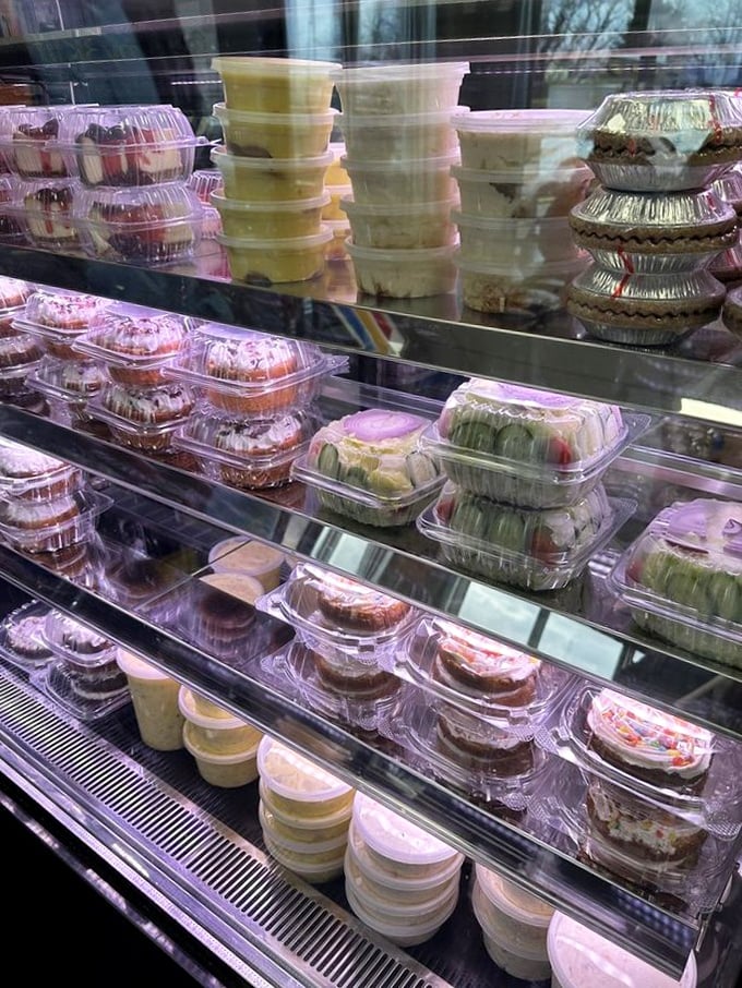 A dessert case that whispers sweet promises after you've conquered all that magnificent fried goodness ahead.
