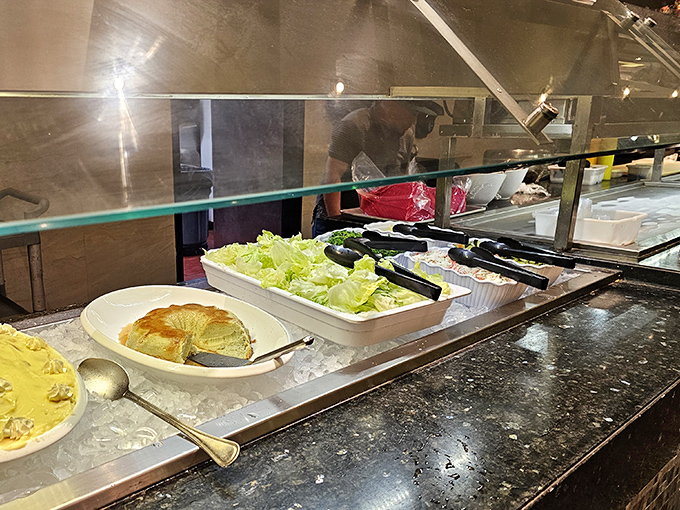 Fresh salad options provide the illusion of virtue before your inevitable return to the crab leg station. Balance is everything, right?