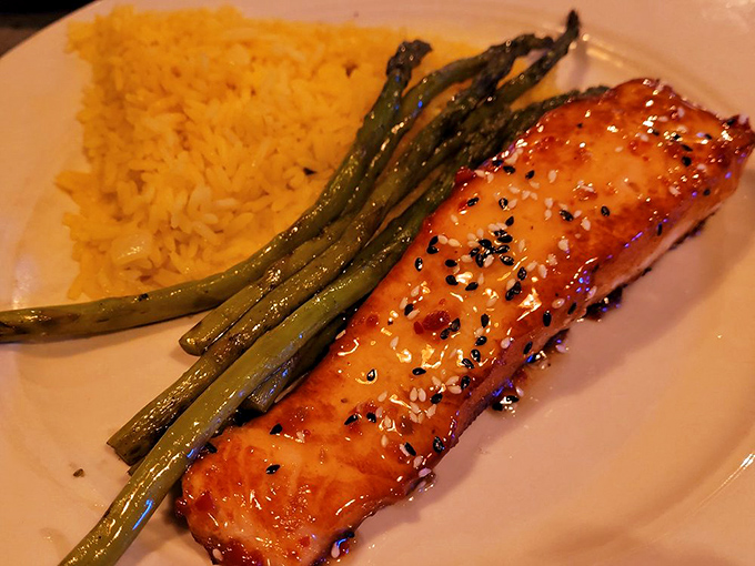 Salmon glazed to caramelized perfection alongside vibrant asparagus. Proof that healthy eating doesn't have to feel like punishment.