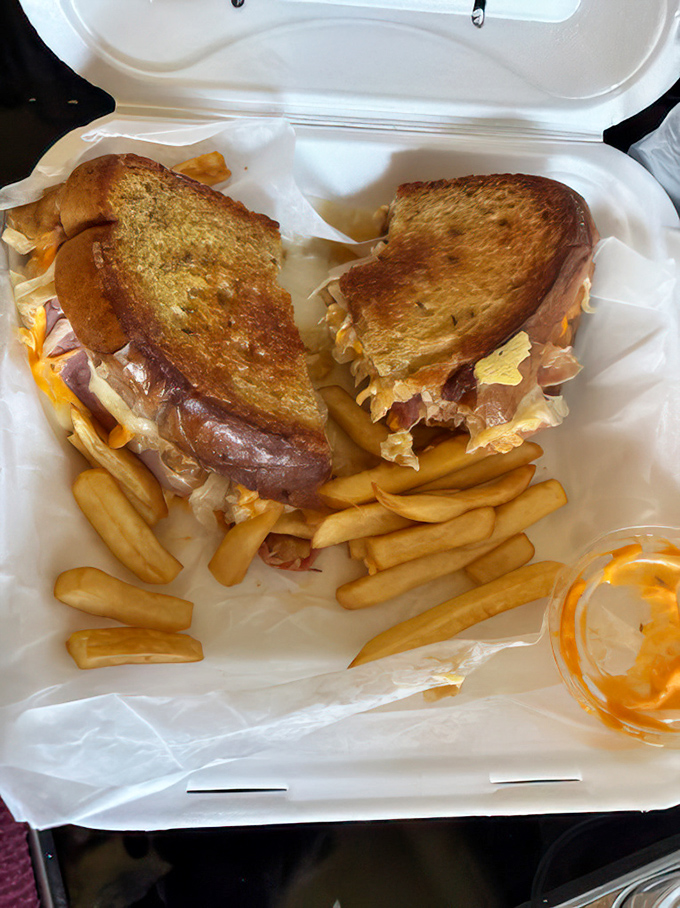 This towering sandwich construction project requires both hands and possibly an engineering degree to navigate properly.