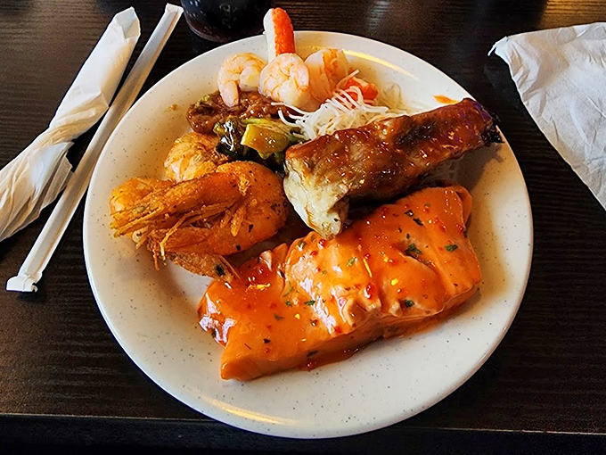 The seafood plate that makes you feel like you've won something. Orange sauce glistening like culinary jewelry.