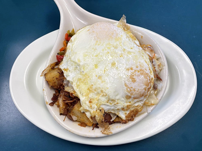 This isn't just a skillet – it's a weekend morning transformed into edible form. The eggs blanket everything like a delicious security system.