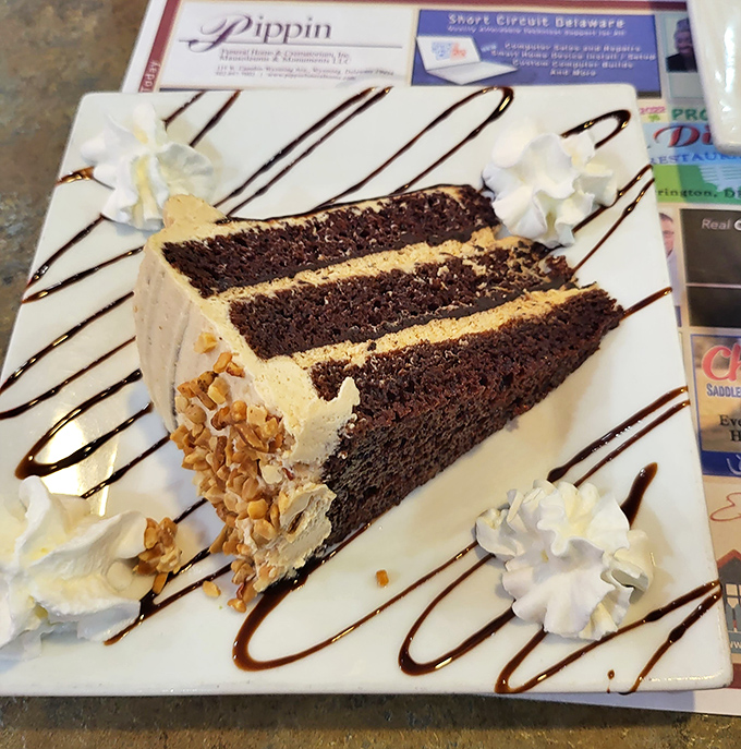This chocolate cake slice could double as a doorstop, but you'll eat every magnificent crumb and consider ordering seconds.