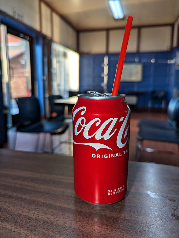 Even the soda comes with no pretense &ndash; just a can, a straw, and the promise of fizzy refreshment against that golden batter.