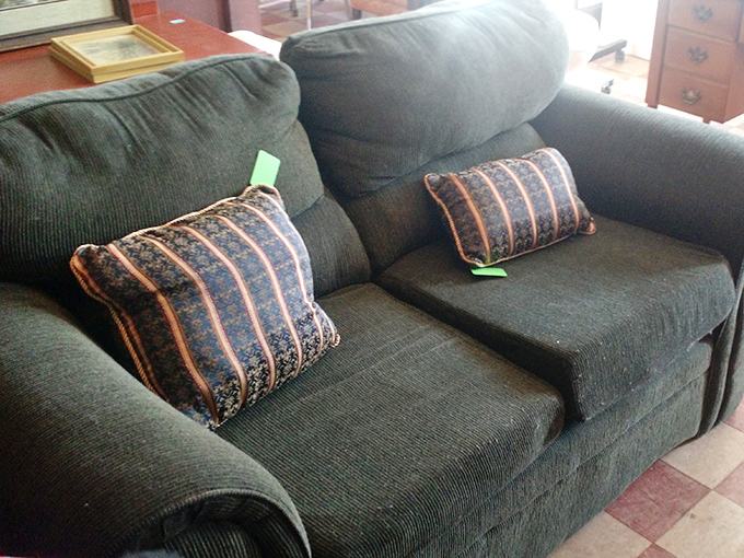 This forest-green sofa hasn't just seen conversations&mdash;it's absorbed them, ready to bring its well-earned comfort and subtle '90s charm to your living room.