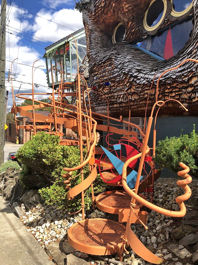 Those orange stairs spiral upward like a path to Oz, if Dorothy had better taste in architecture.