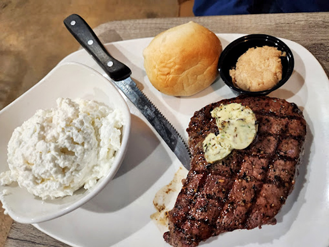 A perfectly grilled steak with compound butter slowly melting into each slice&mdash;carnivore poetry on a plate.