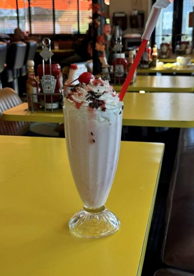 This isn't just a milkshake—it's dessert in a glass, topped with enough whipped cream to make your inner child do backflips.