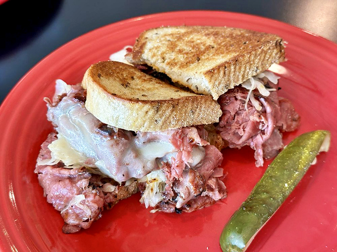 The Reuben that launched a thousand cravings. Corned beef stacked so high it requires jaw gymnastics, with melty Swiss cheese creating those irresistible cheese pulls.