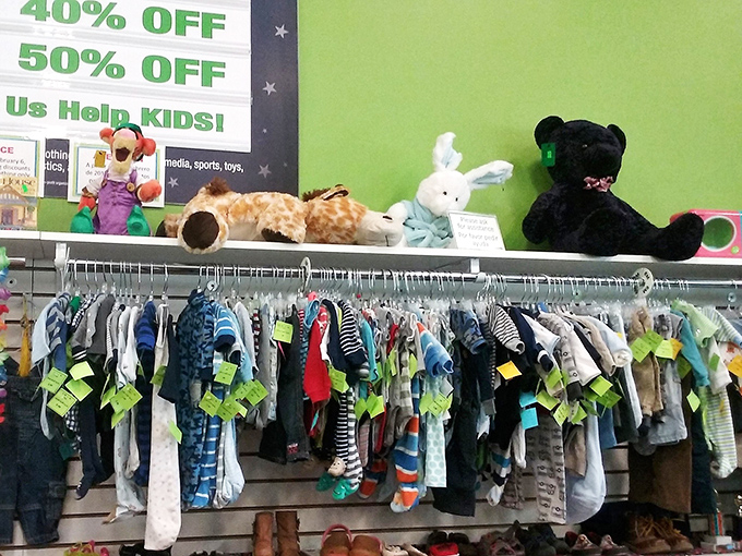 Tiny clothes for tiny humans hang expectantly, while plush animals stand guard overhead&mdash;all priced less than a single baby sock at retail.