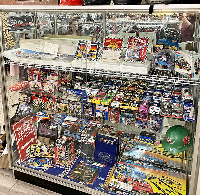 Collectible treasures behind glass, where NASCAR memorabilia and miniature cars await their next passionate enthusiast.