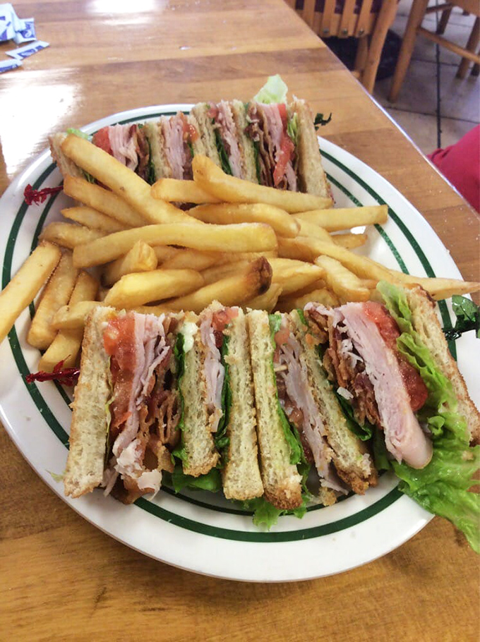 The club sandwich&mdash;diner royalty stacked three layers high. A testament to the timeless truth that everything tastes better with bacon and proper triangular cutting.
