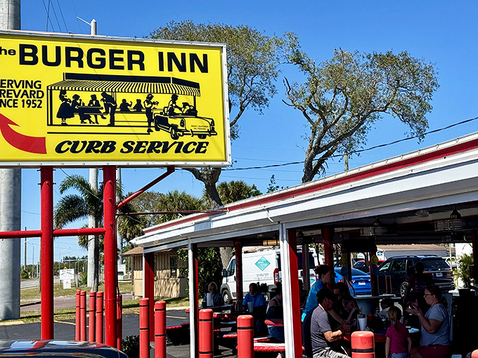 Burger Inn's iconic yellow sign has been guiding hungry folks to burger heaven since 1952. That's staying power!