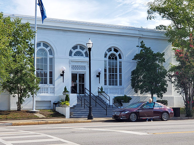 Camden's historic post office gleams white against the blue South Carolina sky. Mail delivery with a side of architectural splendor!
