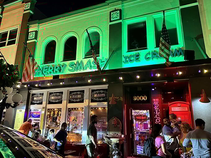 Cherry Smash's emerald glow transforms an ordinary building into an extraordinary ice cream destination after dark.