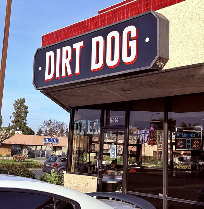 Dirt Dog's bold signage makes a promise that the bacon-wrapped, topping-loaded creations inside absolutely deliver on.