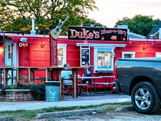 Duke's fiery red exterior and porch seating invite you to slow down, dig in, and maybe tap your foot to some blues.