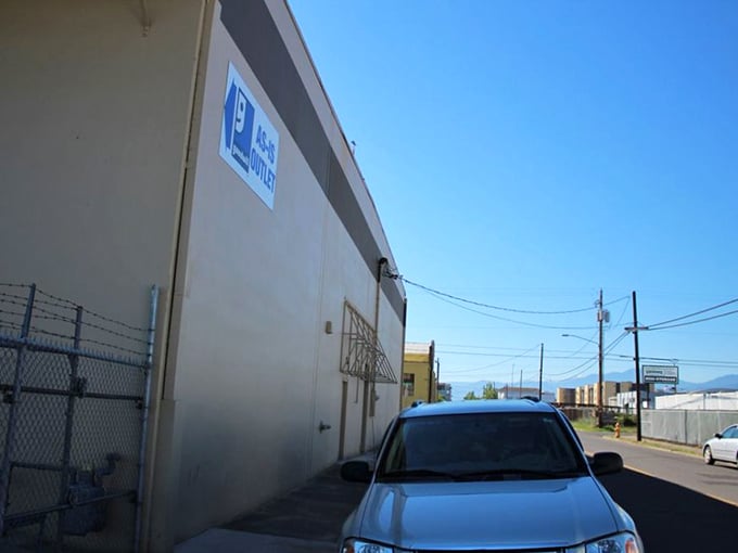 Goodwill's As-Is Outlet doesn't waste money on fancy signage. All their resources go into what matters: mountains of potential treasures inside.