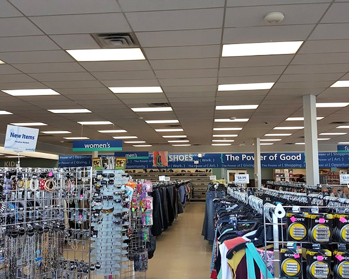 Inside Goodwill, racks of clothing stretch toward the horizon like a secondhand fashion superhighway.