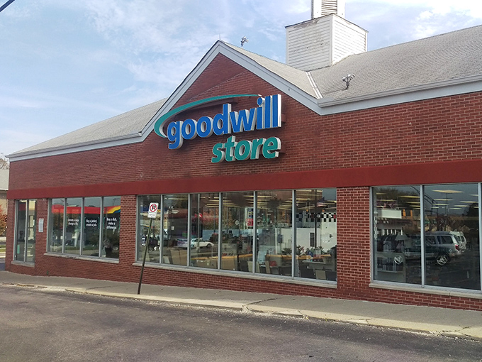 Goodwill's cheerful red brick building stands ready to fulfill your thrifting dreams and support community programs.