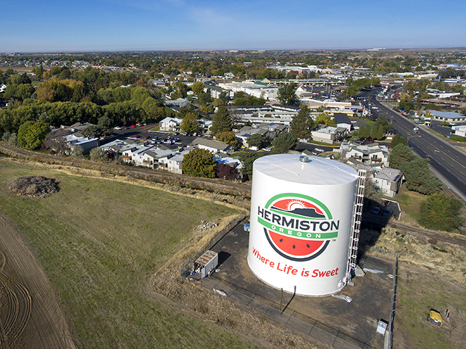 Hermiston's watermelon-adorned water tower stands tall against the sunset, a sweet reminder of this affordable farming community.