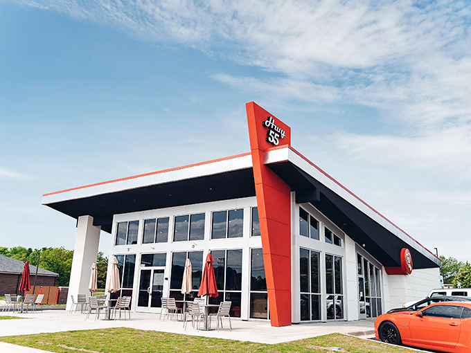 Hwy 55's sleek, retro-modern design gleams in the sunlight, a temple to the timeless American burger experience.