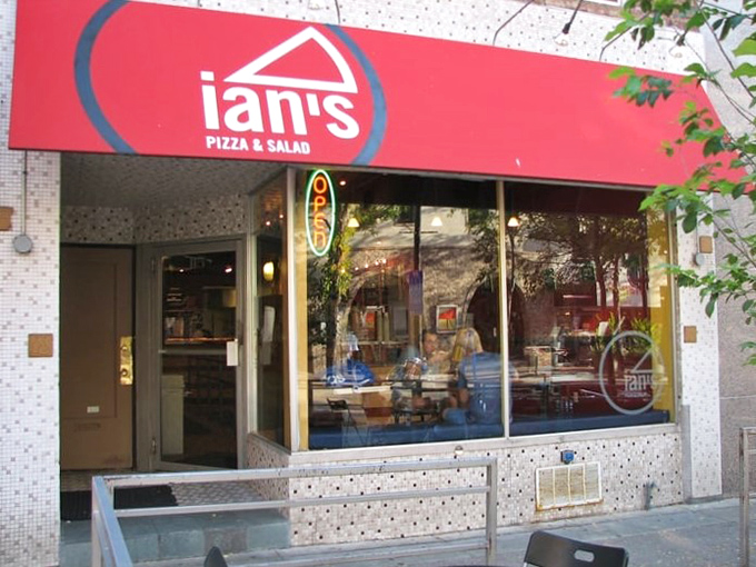 Ian's Pizza's simple storefront hides Madison's most creative slice combinations. That red sign might as well say "Pizza Adventure Starts Here."