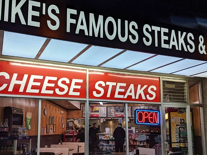 Mike's Famous glows with neon promise. Those red "CHEESE STEAKS" letters are like Vegas lights for hungry Delawareans.