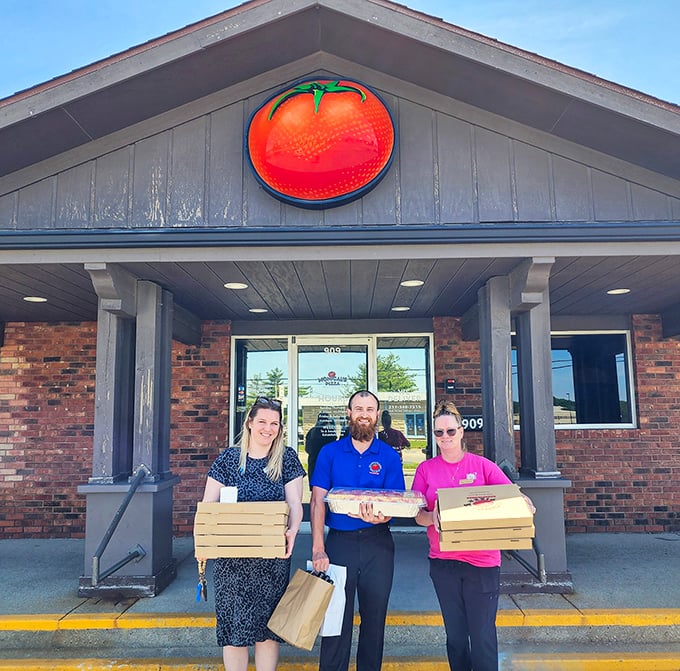 Nothing says "We take pizza seriously" like staff proudly displaying their boxed-up treasures outside the restaurant.