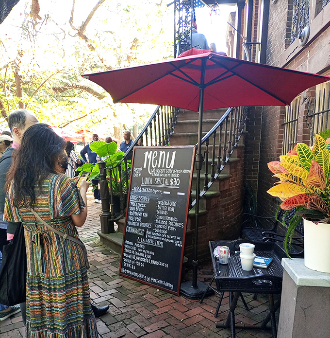 Hidden behind brick and greenery, Savannah's communal dining legend proves the best restaurants don't need flashy signs.